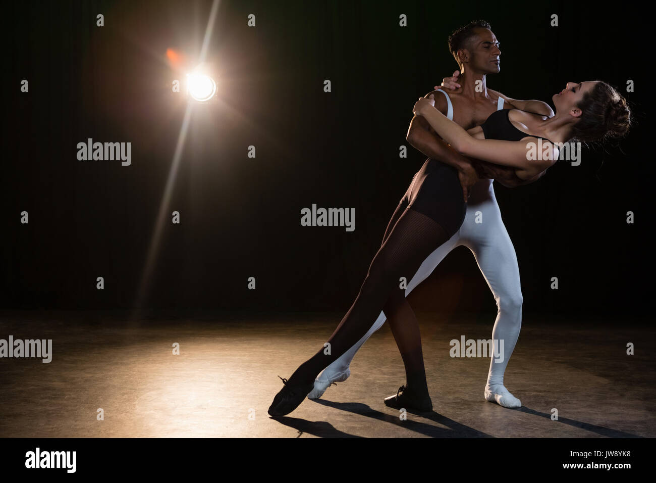 Ballet partners practicing ballet dance in stage Stock Photo - Alamy