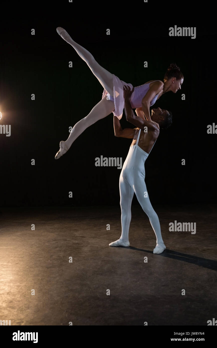 Ballet partners practicing ballet dance in stage Stock Photo - Alamy