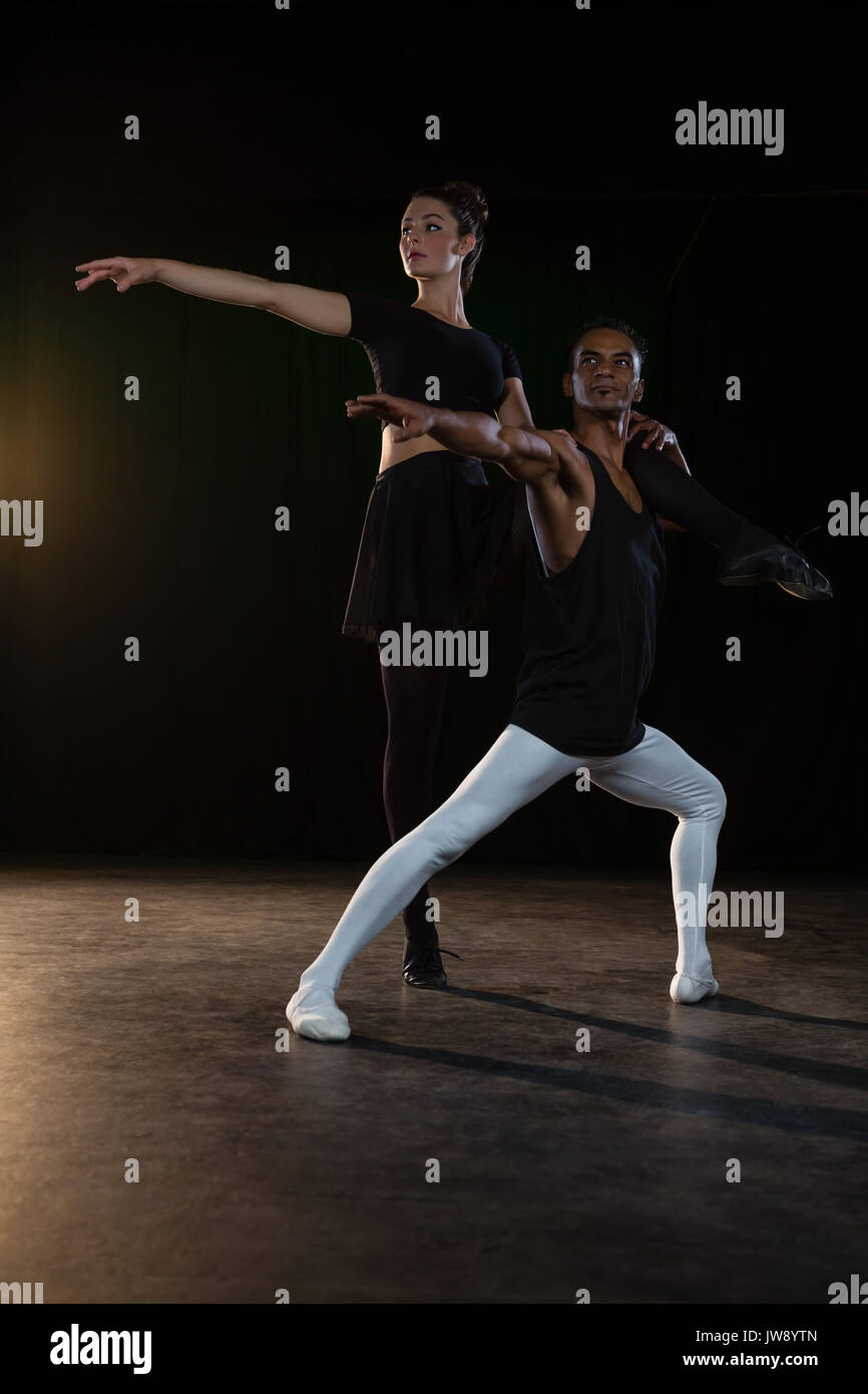 Ballet partners practicing ballet dance in stage Stock Photo - Alamy