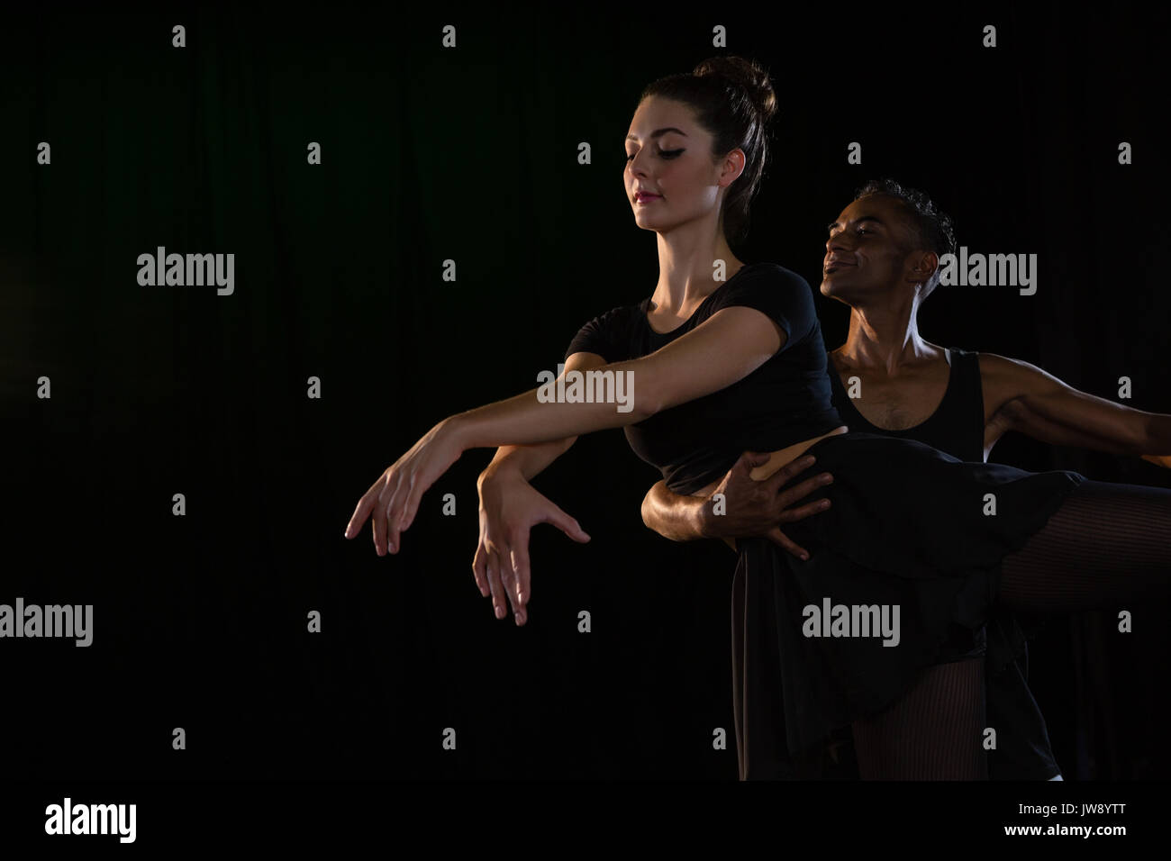 Ballet partners practicing ballet dance in stage Stock Photo - Alamy