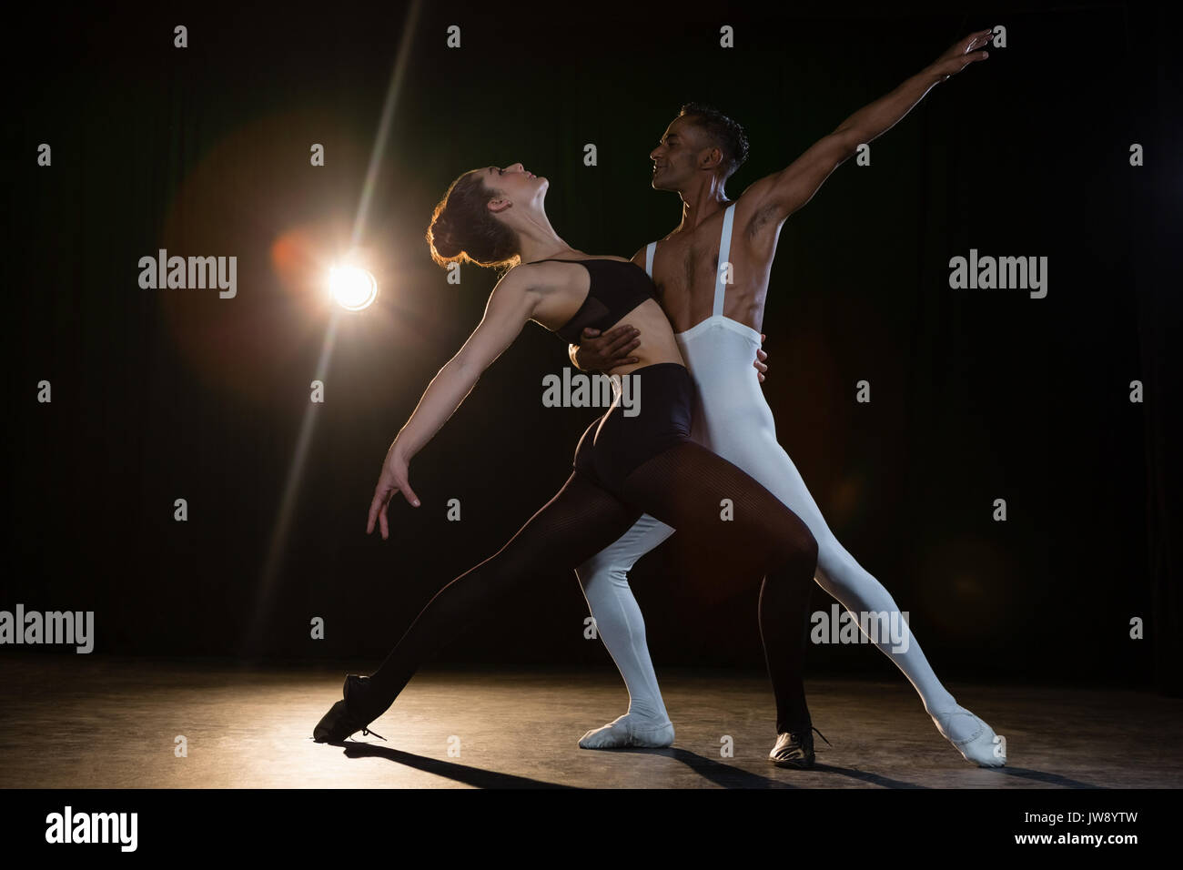 Ballet partners practicing ballet dance in stage Stock Photo - Alamy
