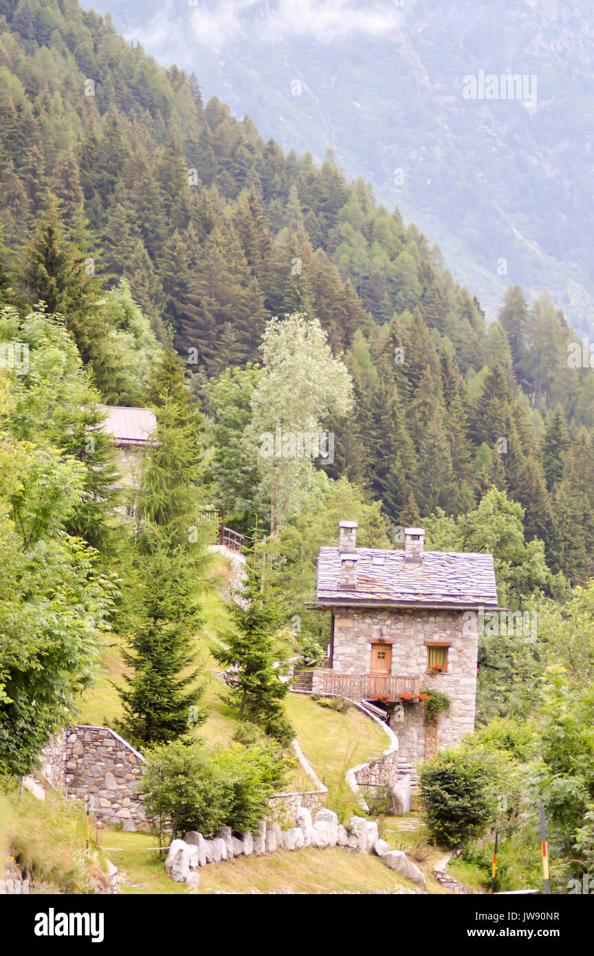 Traditional stone chalet in a dolomite pass in Italy Stock Photo - Alamy