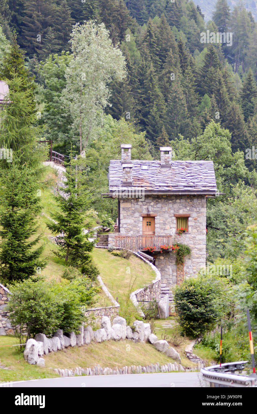 Traditional stone chalet in a dolomite pass in Italy Stock Photo - Alamy