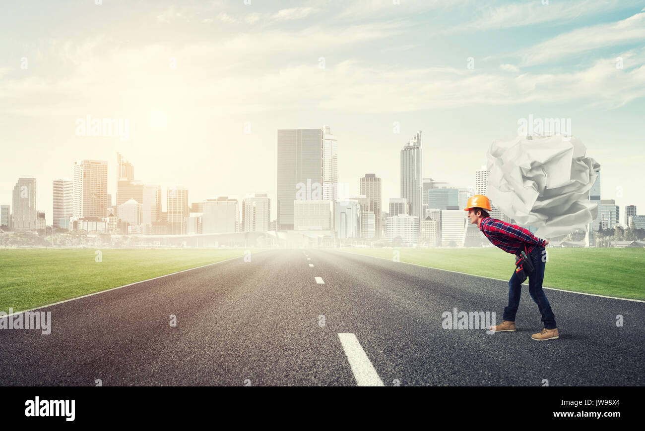 Engineer man carry load Stock Photo - Alamy