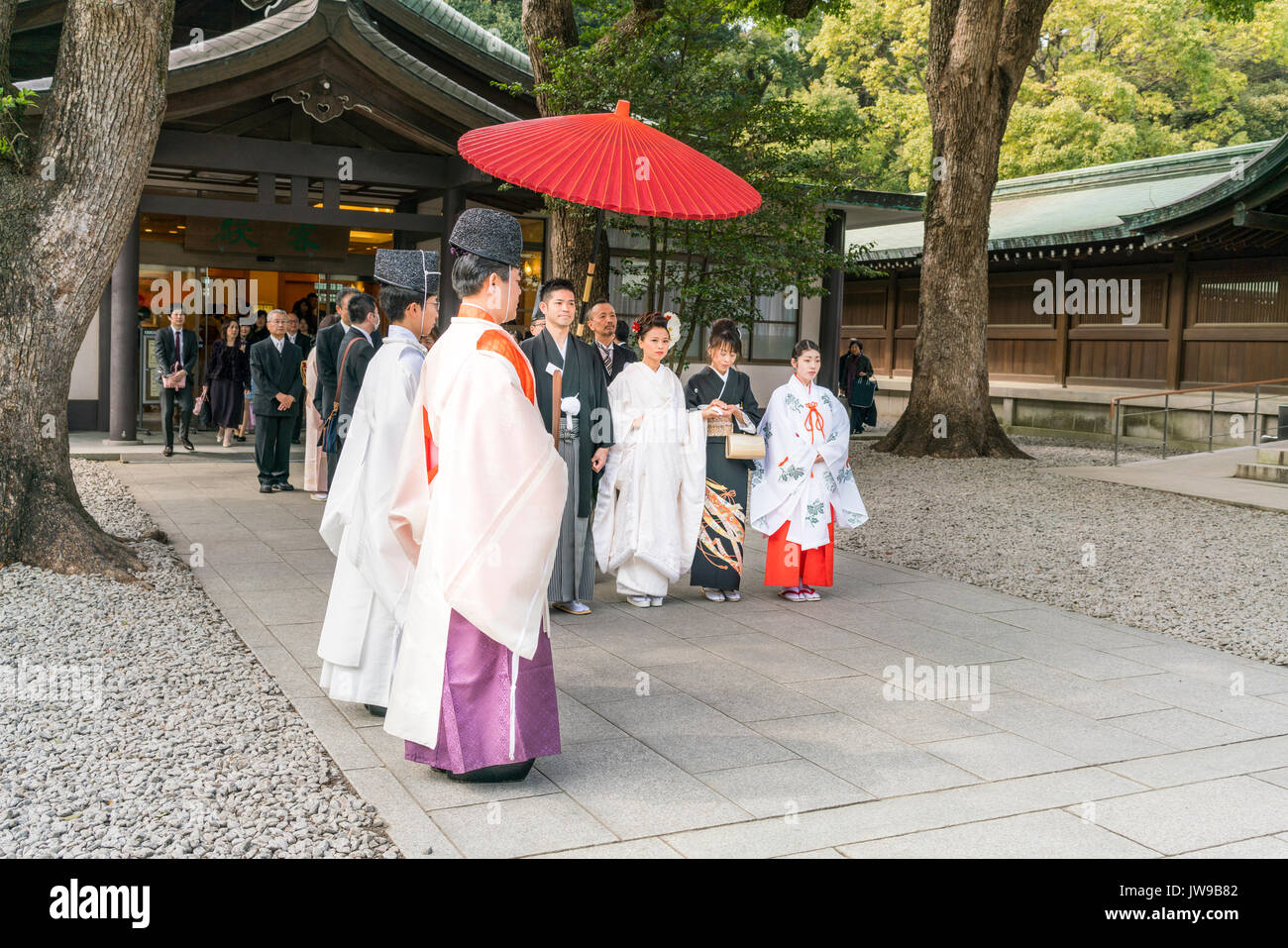 Traditional Japanese wedding ceremony with red umbrella and procession ...