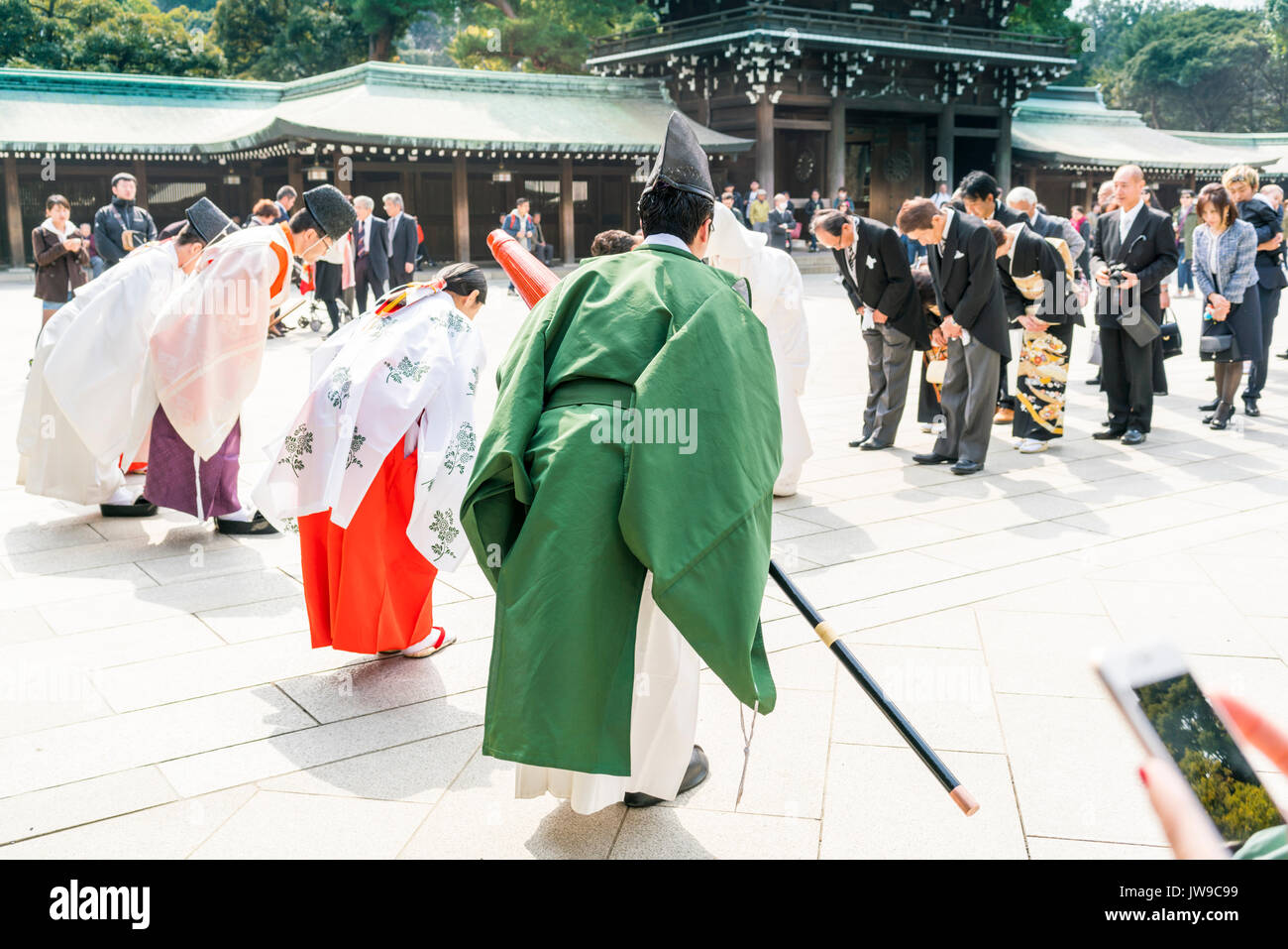 Traditional Japanese wedding ceremony with red umbrella and procession ...