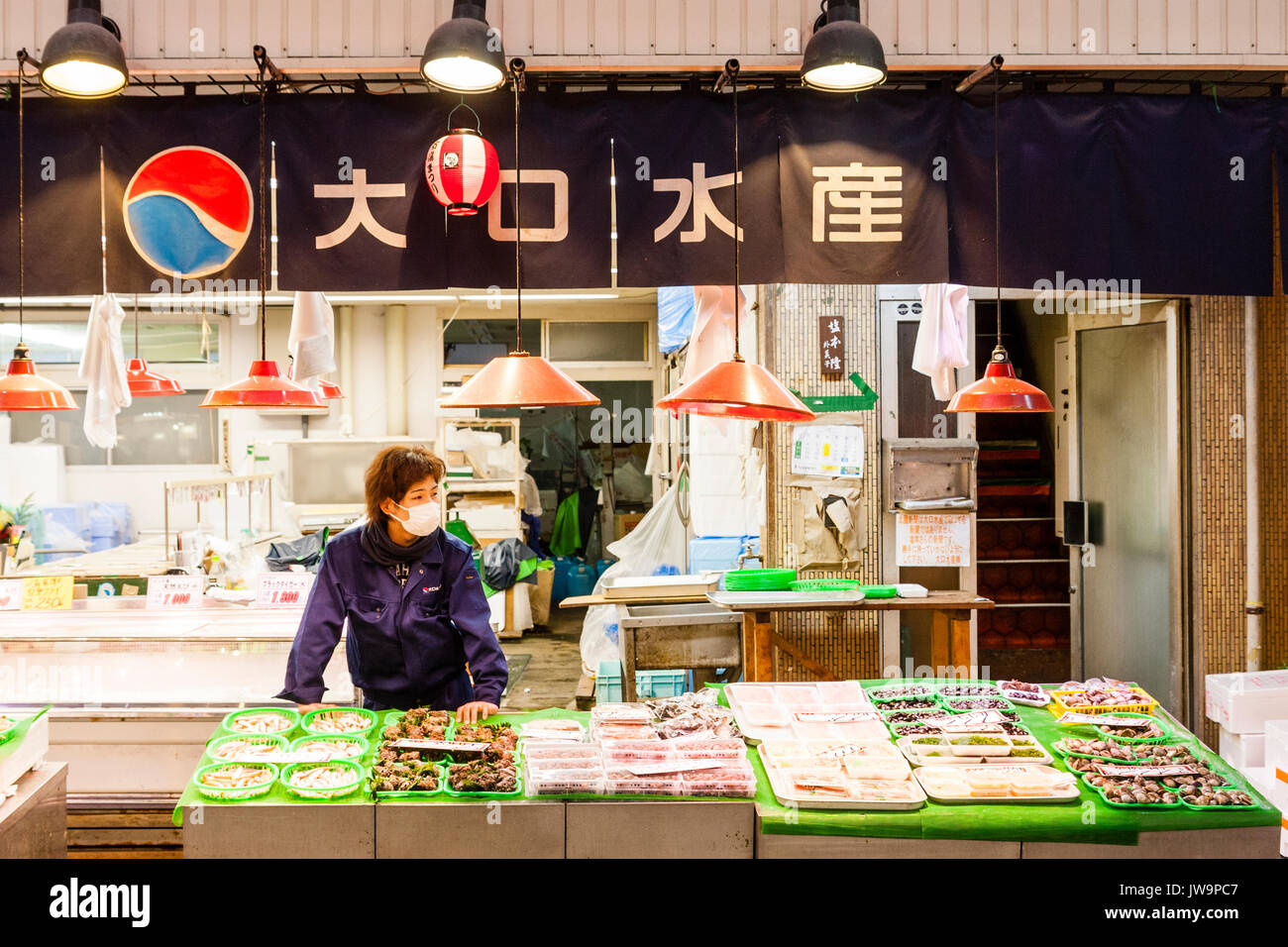Fresh fish on display, many pre-packed in plastic packets, pm counter ...