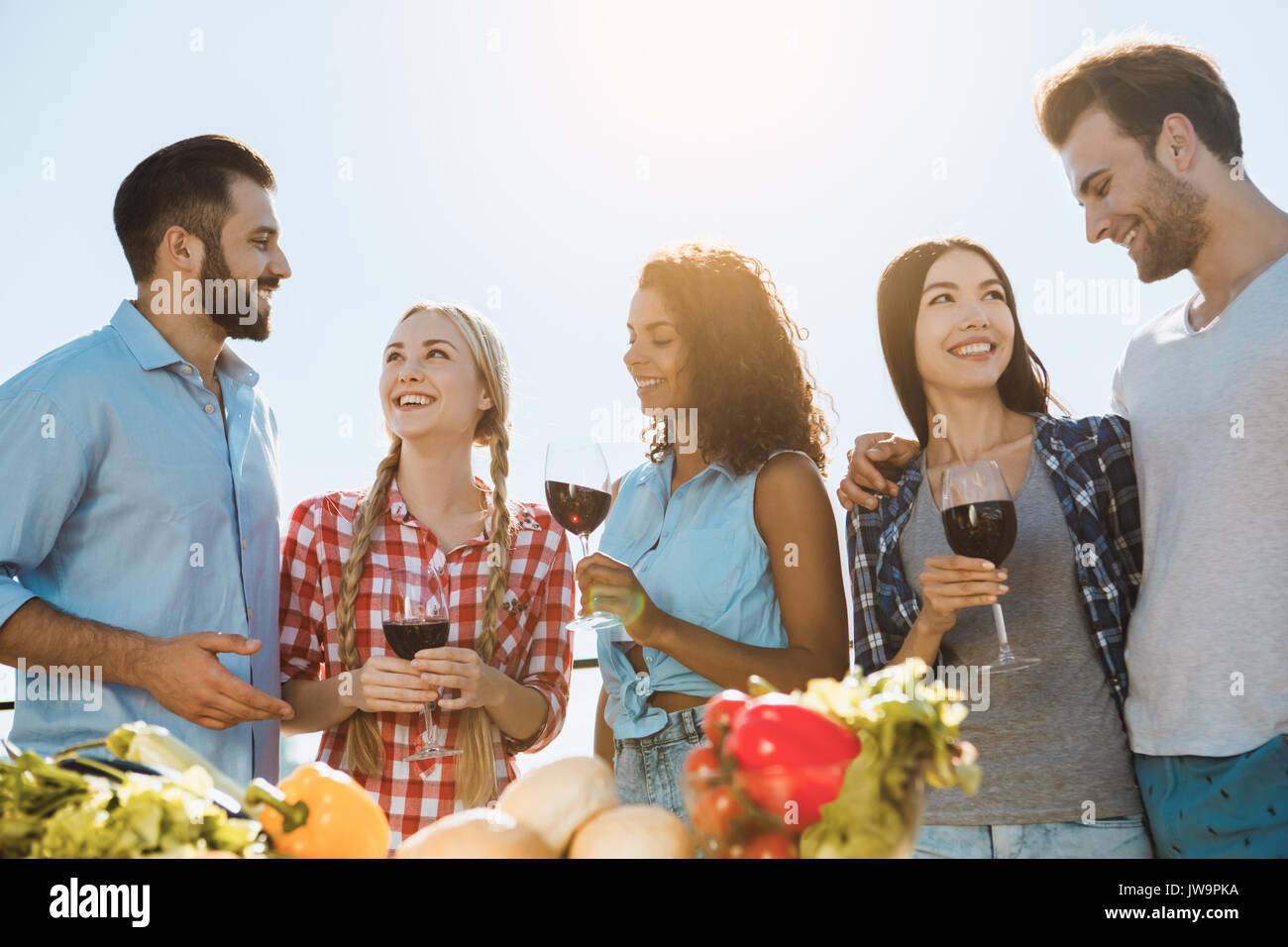Group of people having barbecue party communication Stock Photo - Alamy