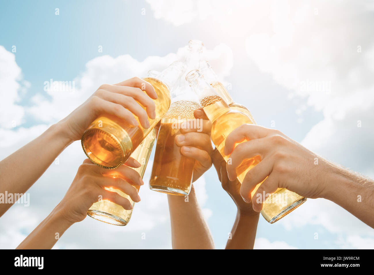Group of people having barbecue party drinking beer Stock Photo - Alamy