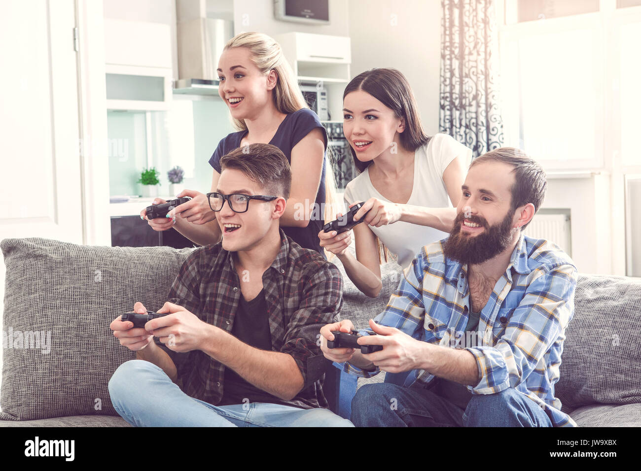 Friends having party together indoors playing video games Stock Photo ...