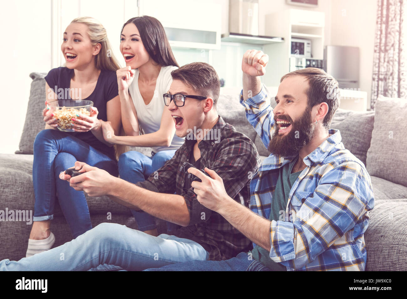 Group young friends playing virtual hi-res stock photography and images ...