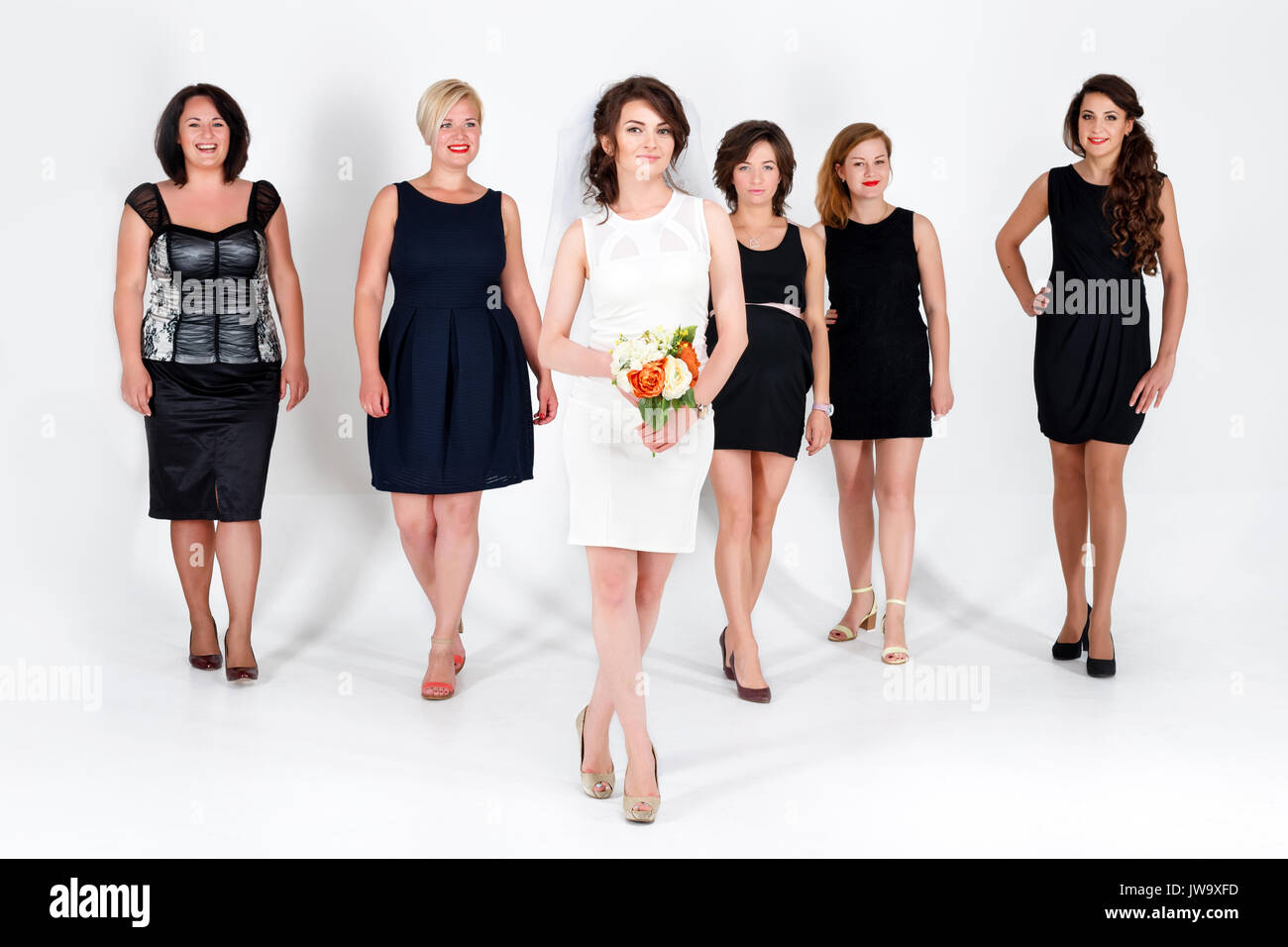 Stylish bridesmaids having fun with bride. Cheerful happy girls ...