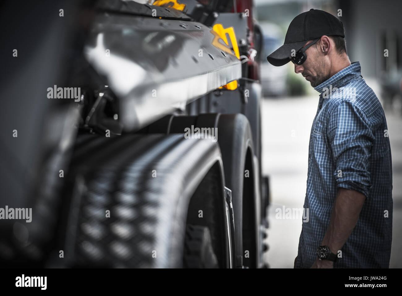 Truck Driver Load Check. Caucasian Semi Truck Driver Checking on His ...