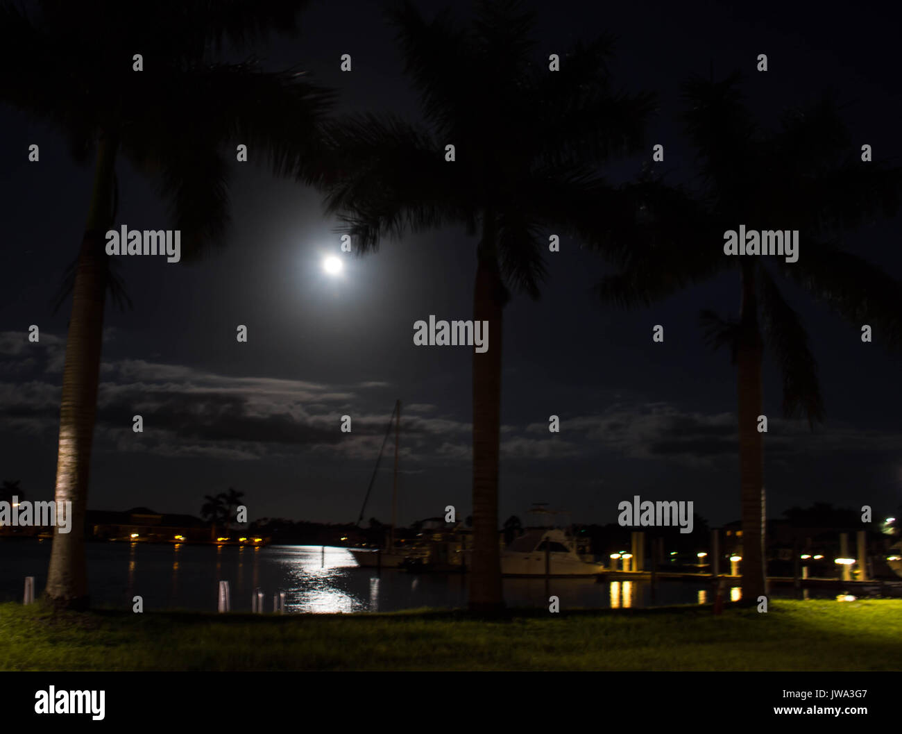 A full Moon in peaceful Port of the Islands marina Stock Photo - Alamy