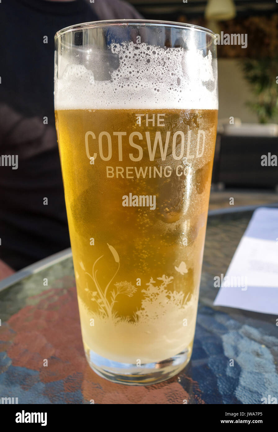 A pint of beer in a pint glass from The Cotswold Brewing Company ...