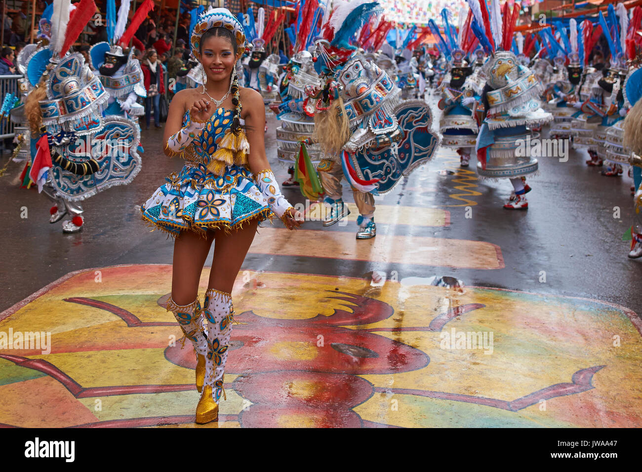 Morenada dance group in colourful outfits parading through the mining ...