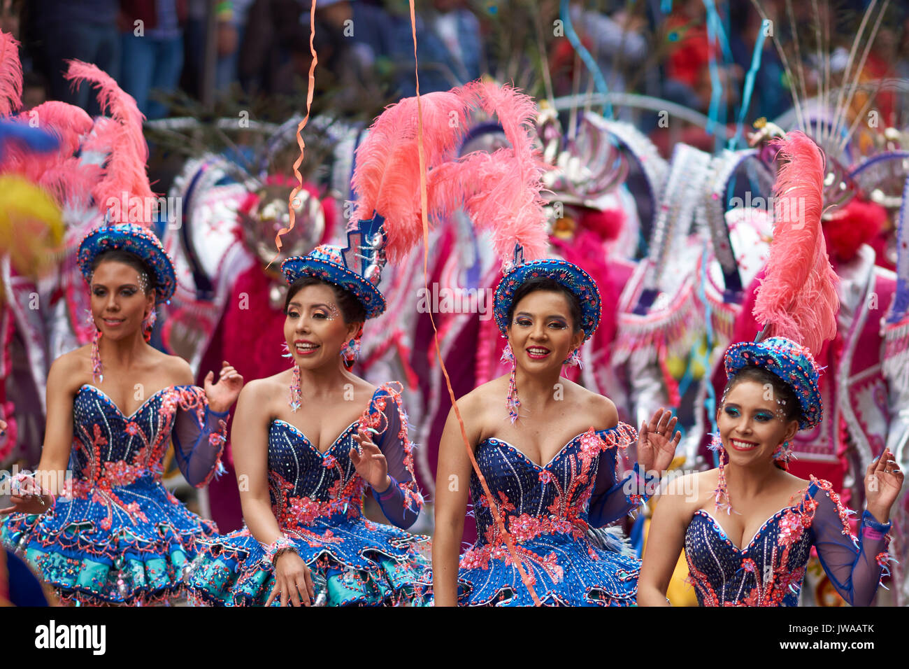 Morenada dance group in colourful outfits parading through the mining ...