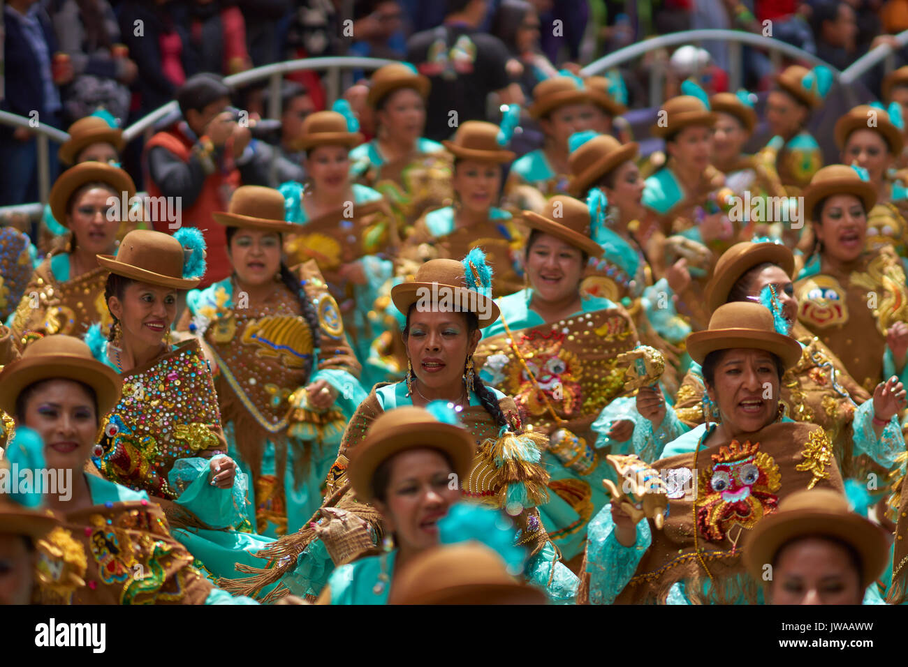 Morenada dance group in colourful outfits parading through the mining ...