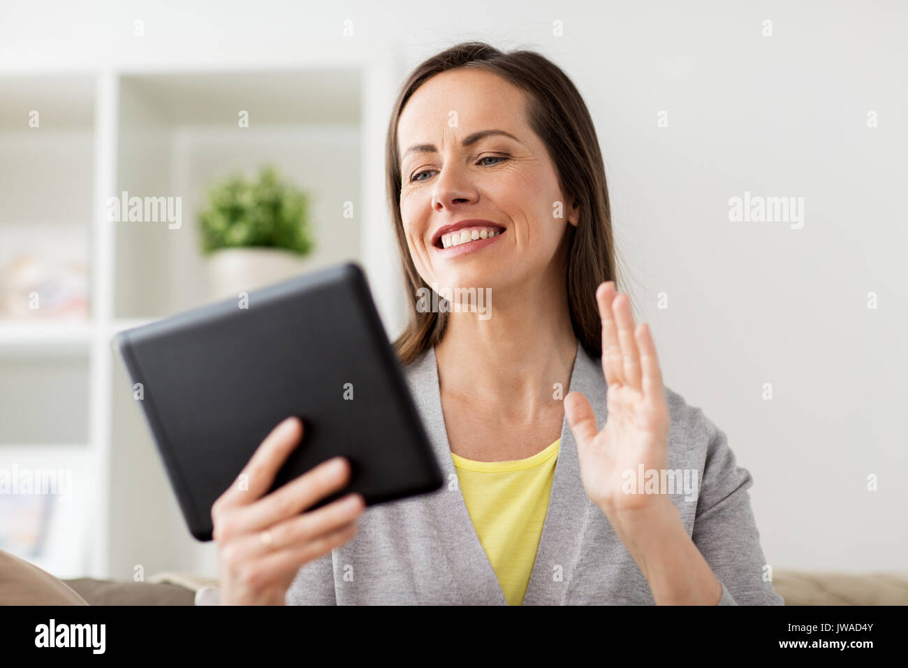 Smiling woman having video chat hi-res stock photography and images - Alamy