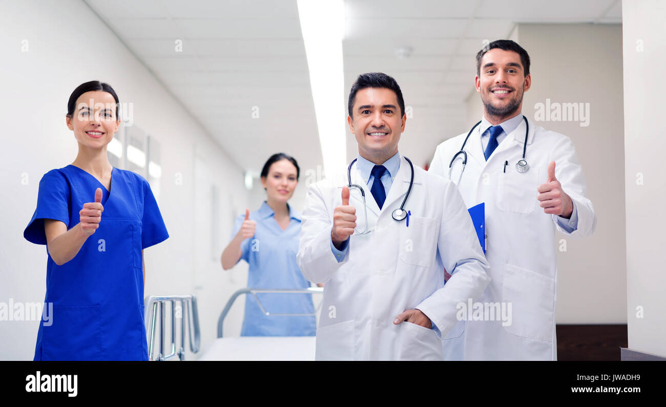 happy doctors showing thumbs up at hospital Stock Photo - Alamy