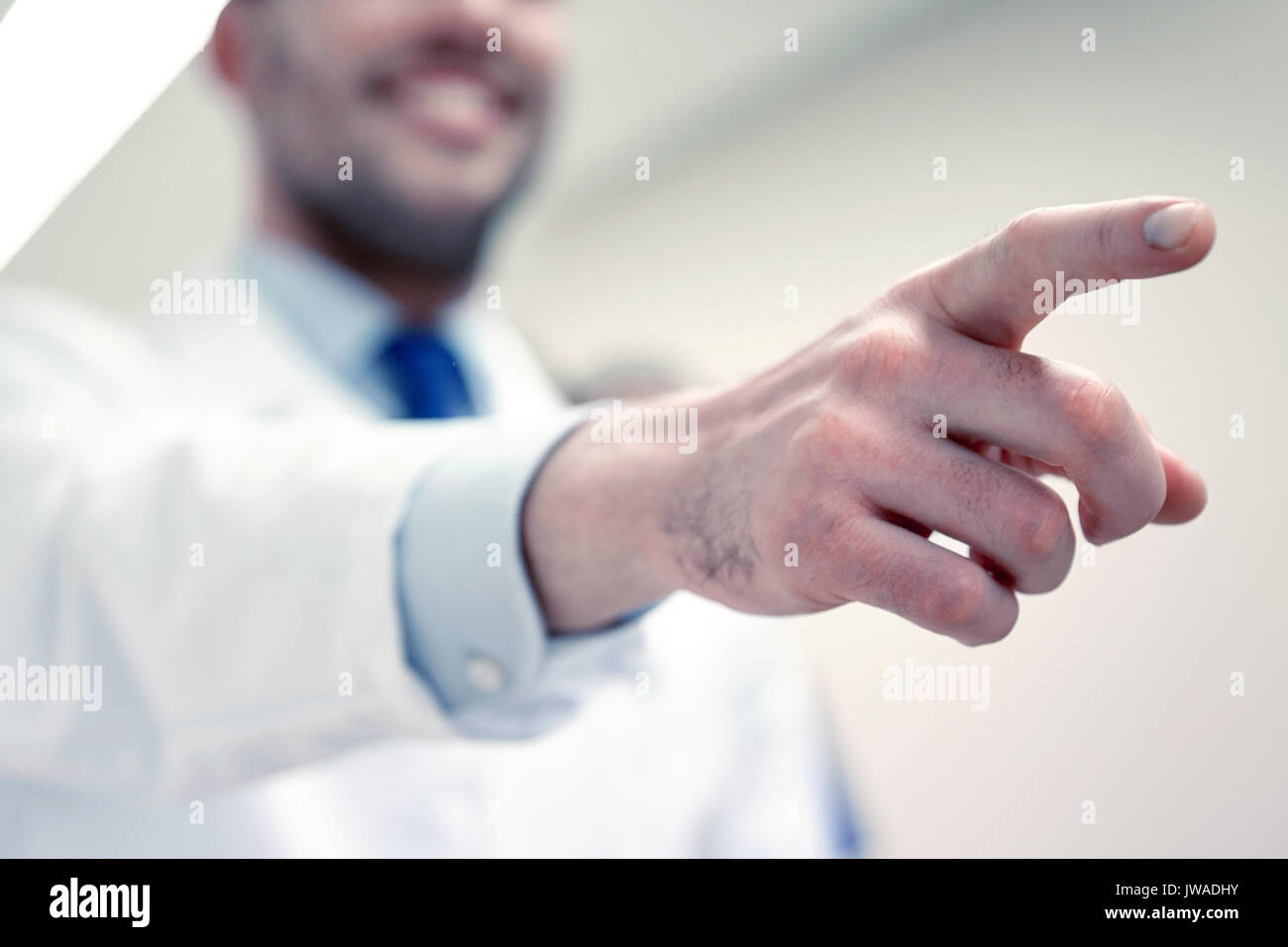 Doctor pointing his finger hi-res stock photography and images - Alamy