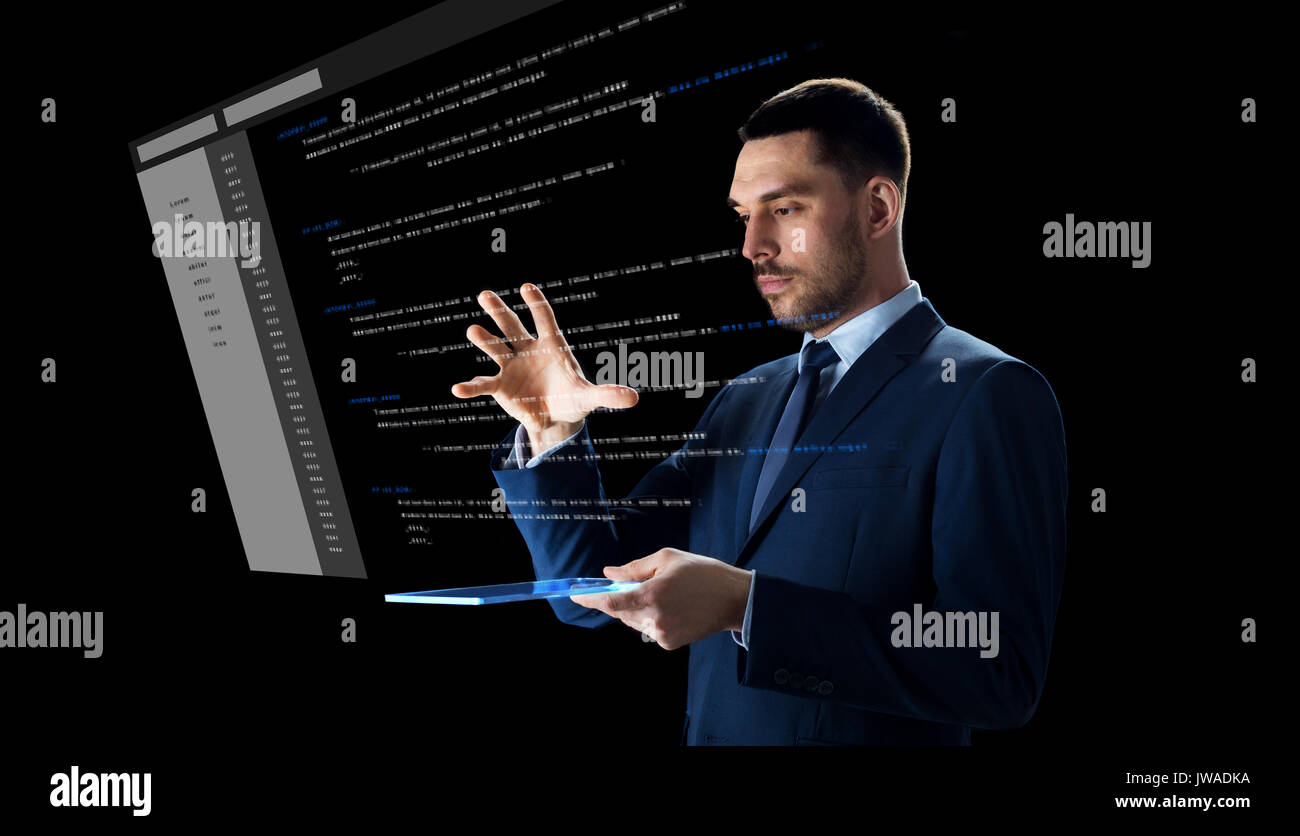 businessman with tablet pc and virtual coding Stock Photo - Alamy