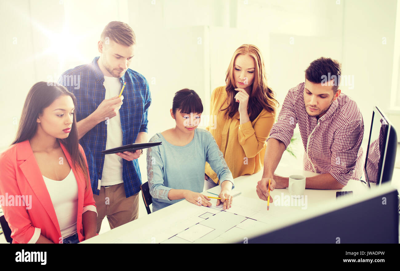 creative team with blueprint working at office Stock Photo - Alamy