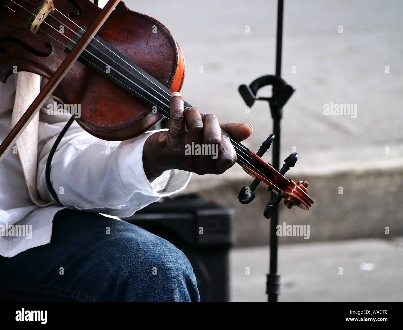 Man playing fiddle in street hi-res stock photography and images - Alamy