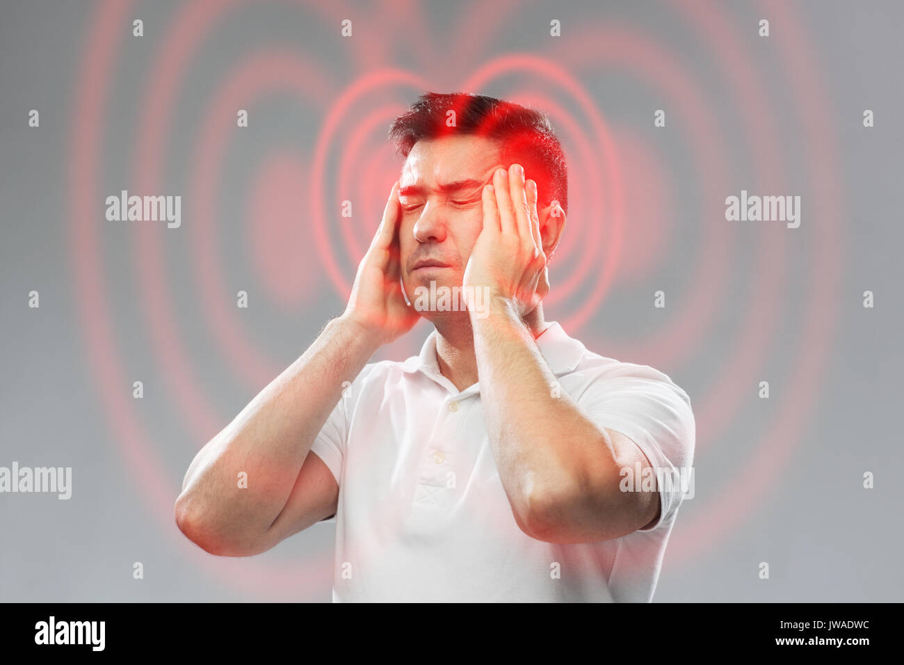 unhappy man suffering from head ache Stock Photo - Alamy