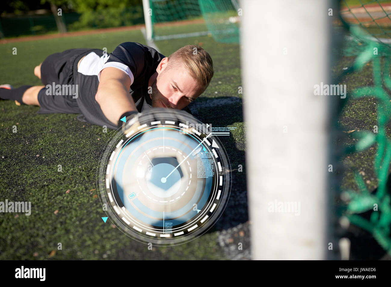 goalkeeper with ball at football goal on field Stock Photo - Alamy