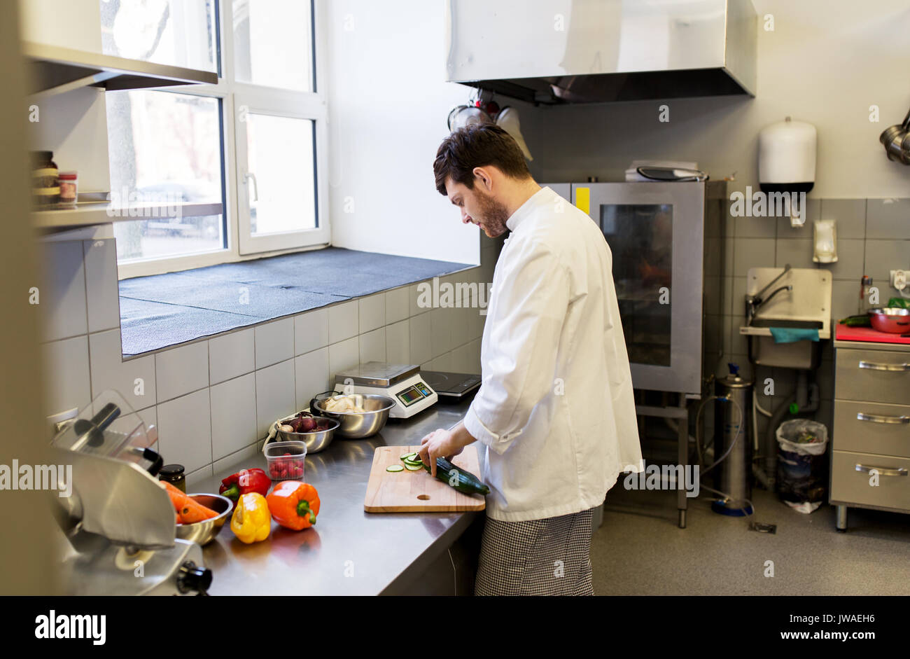 happy male chef cooking food at restaurant kitchen Stock Photo - Alamy
