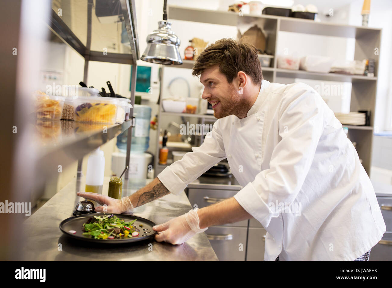 happy male chef cooking food at restaurant kitchen Stock Photo - Alamy happy male chef cooking food at restaurant kitchen Stock Photo - Alamy