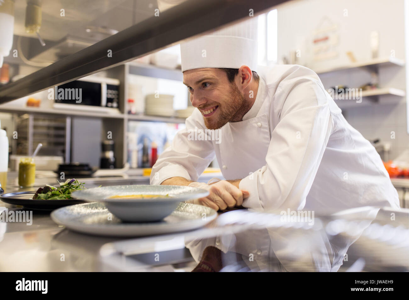 happy male chef cooking food at restaurant kitchen Stock Photo - Alamy
