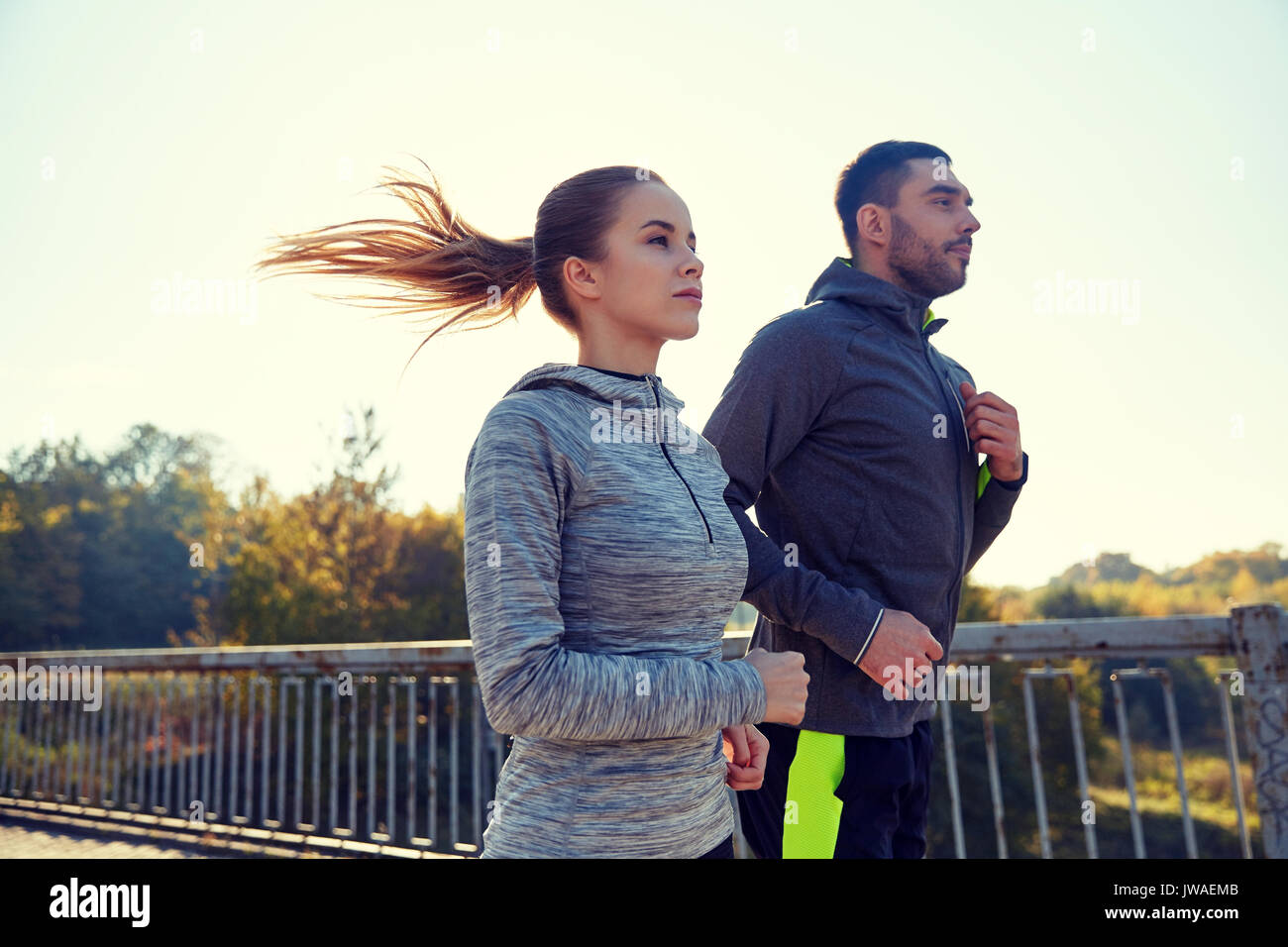 Happy couple runner road hi-res stock photography and images - Alamy