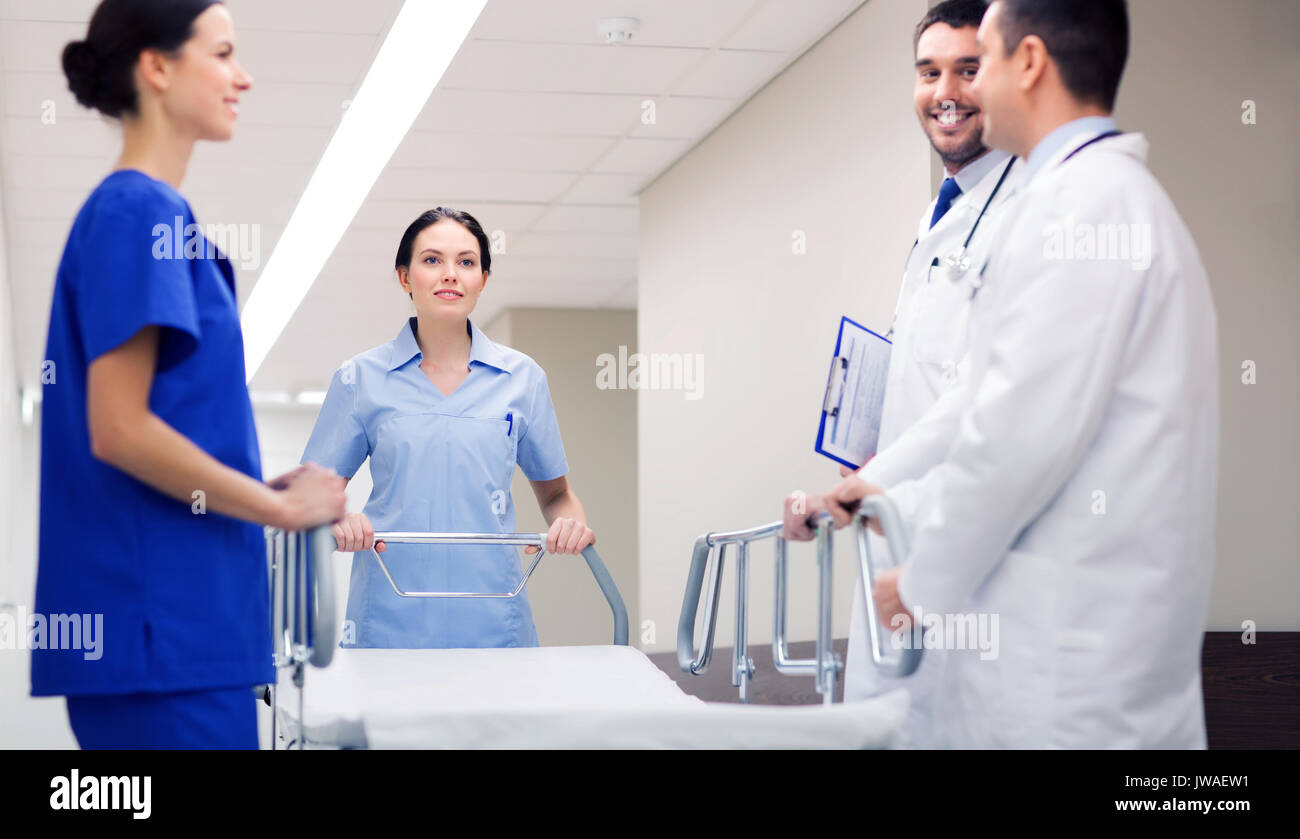 group of happy doctors with gurney at hospital Stock Photo - Alamy