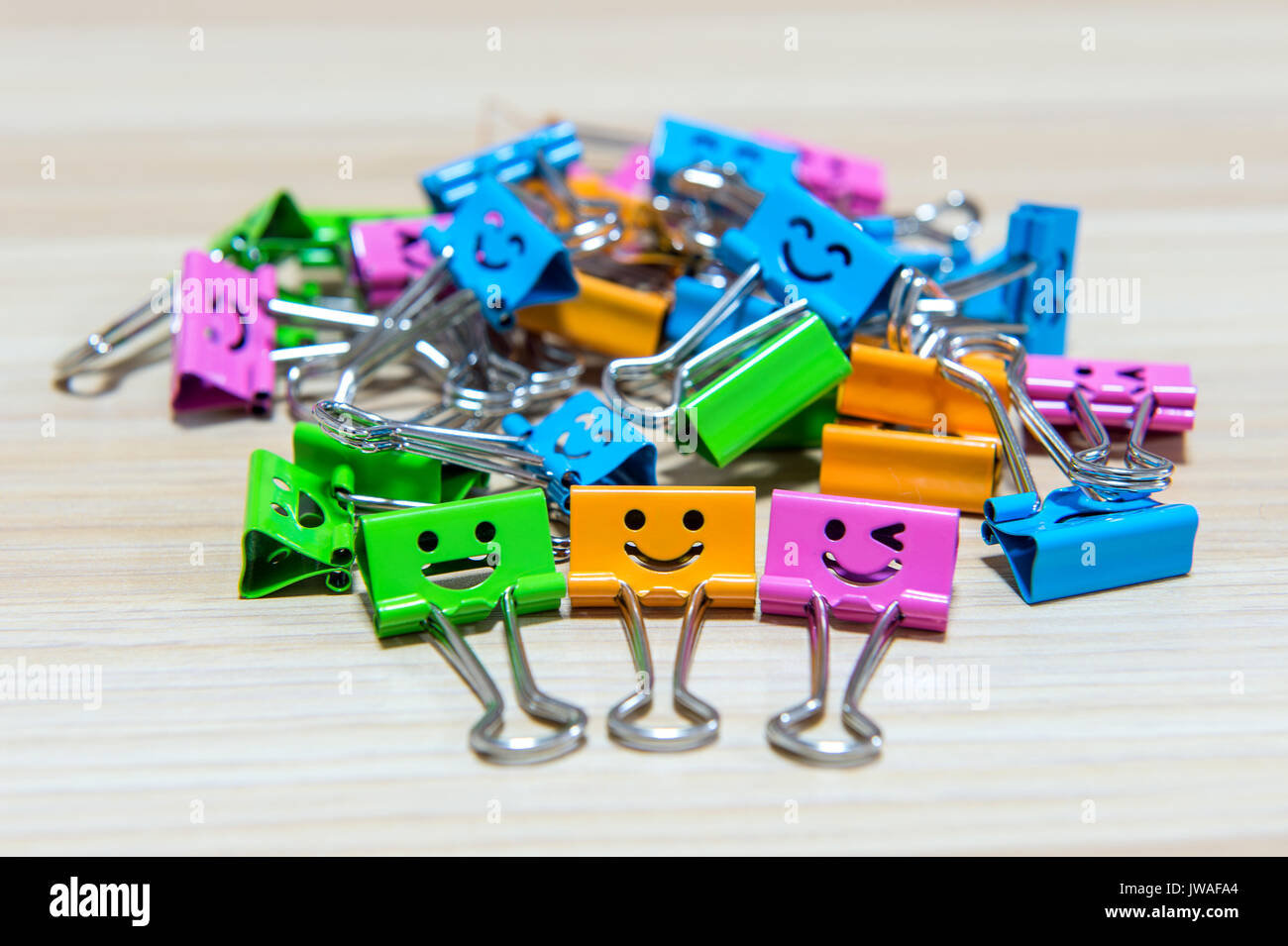 Colorful paper clips. Smile paper clips Stock Photo - Alamy