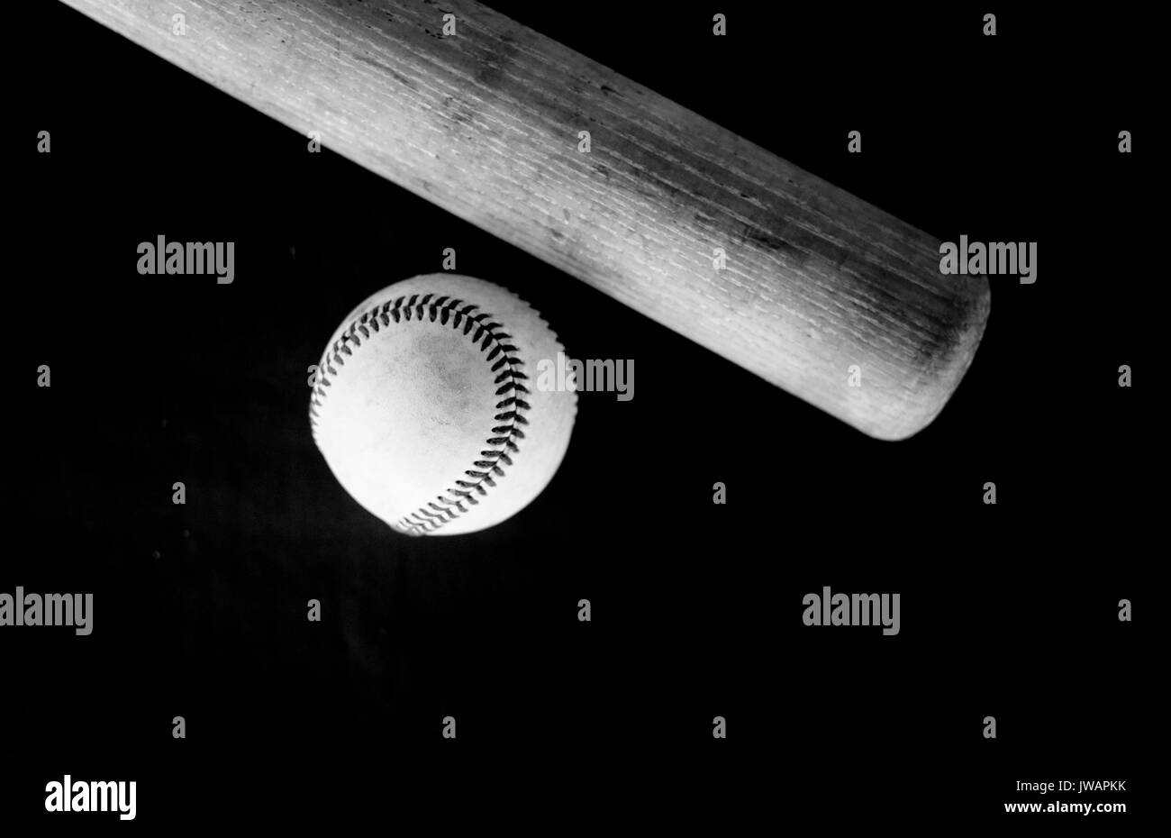 Vintage baseball bat and ball laying flat on the black background ...
