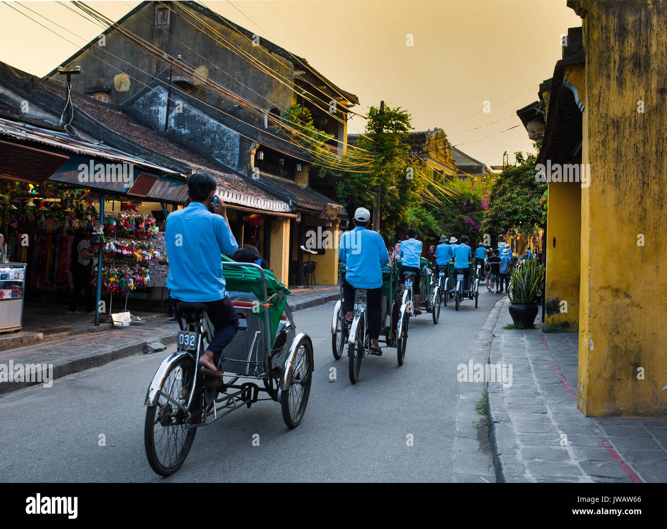 Man riding a traditional cycle in Hoi An.Hoi An Stock Photo - Alamy