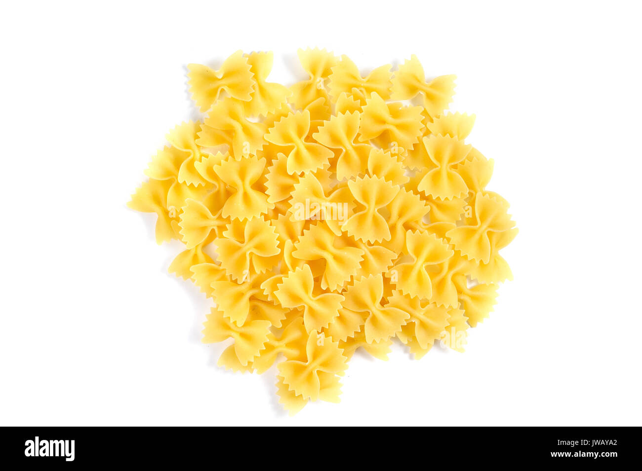 Heap of ribbons pasta isolated on white background Stock Photo - Alamy