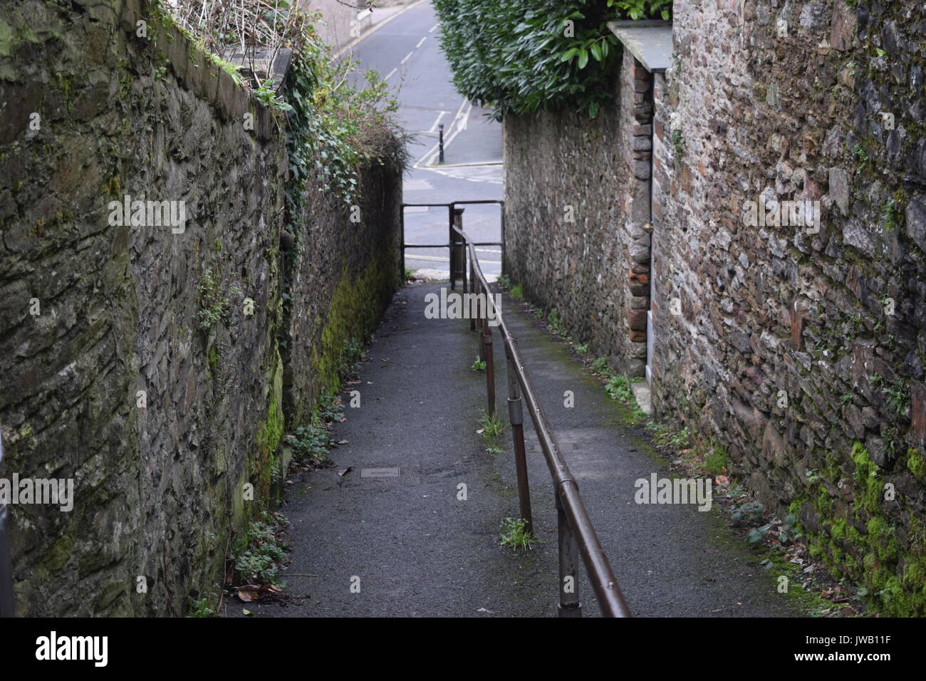 Narrow alleyway with outdoor ventilation with pipes Stock Photo - Alamy