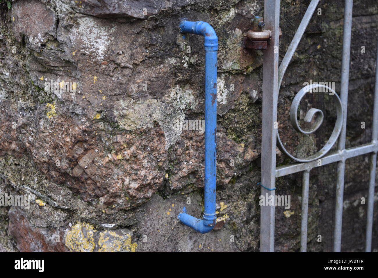 Narrow alleyway with outdoor ventilation with pipes Stock Photo - Alamy