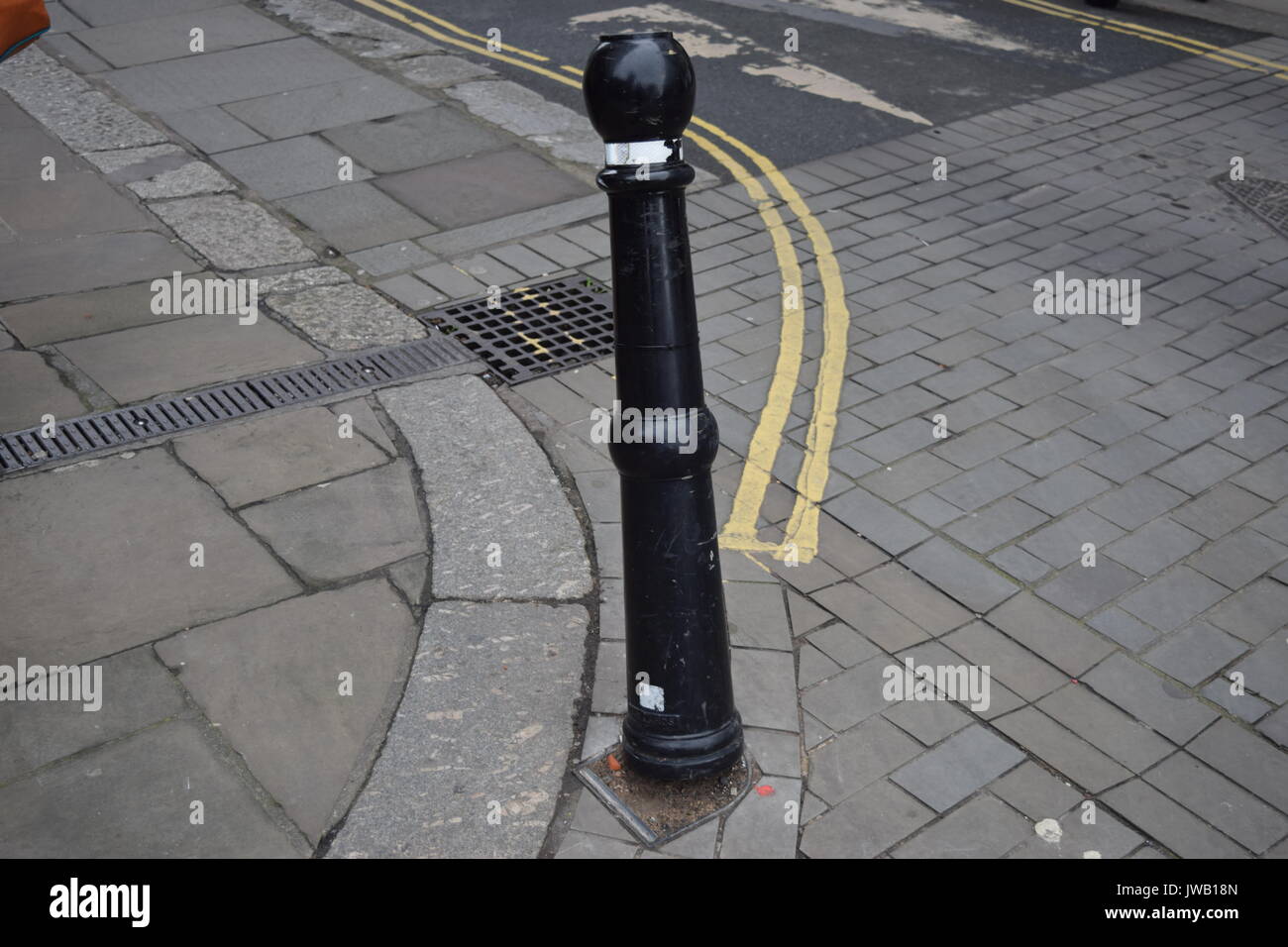 Black pole on the street Stock Photo - Alamy