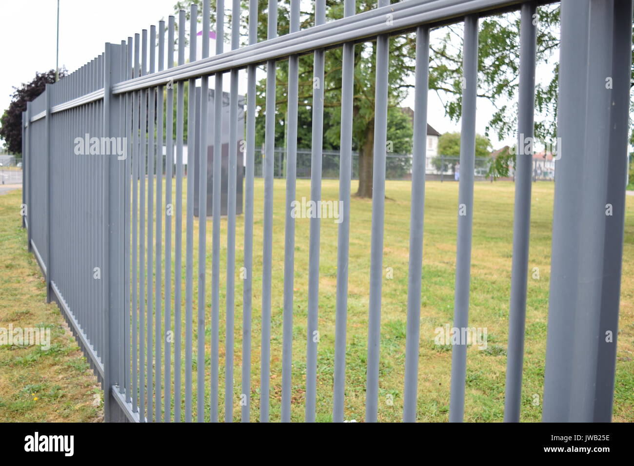 Side perspective of a metal fence Stock Photo - Alamy