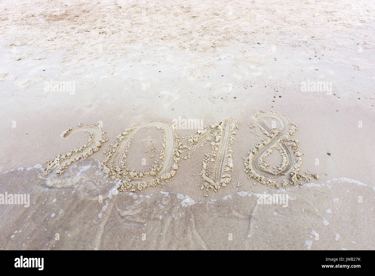 2018 written on sandy hi-res stock photography and images - Alamy