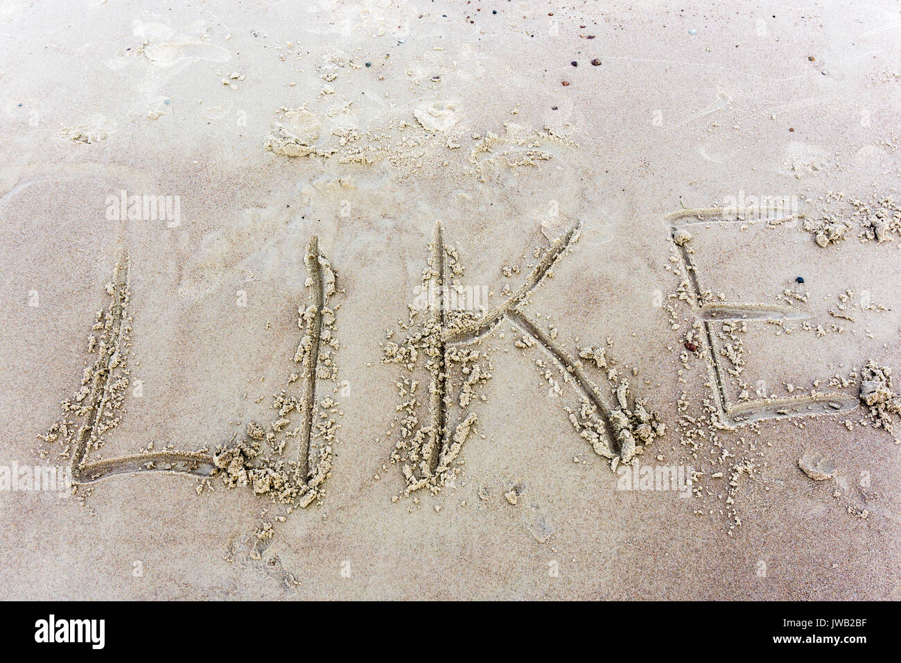 Like written in the sand on a sunset beach. Social networks concept ...