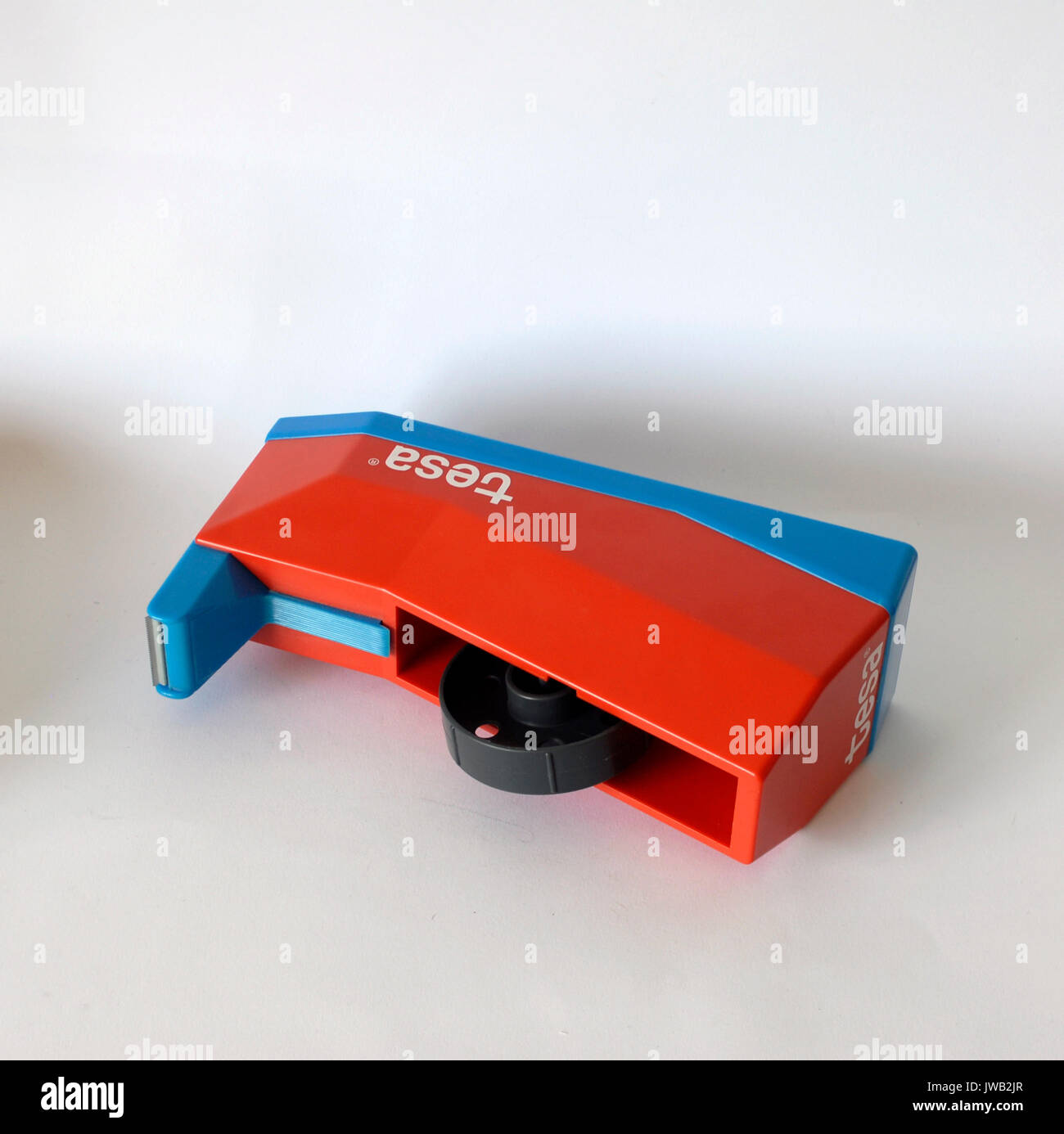 Vintage orange and light blue plastic tape dispenser Stock Photo - Alamy