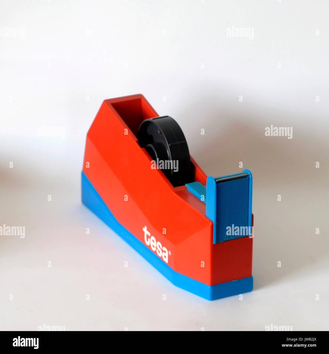 Vintage orange and light blue plastic tape dispenser Stock Photo - Alamy
