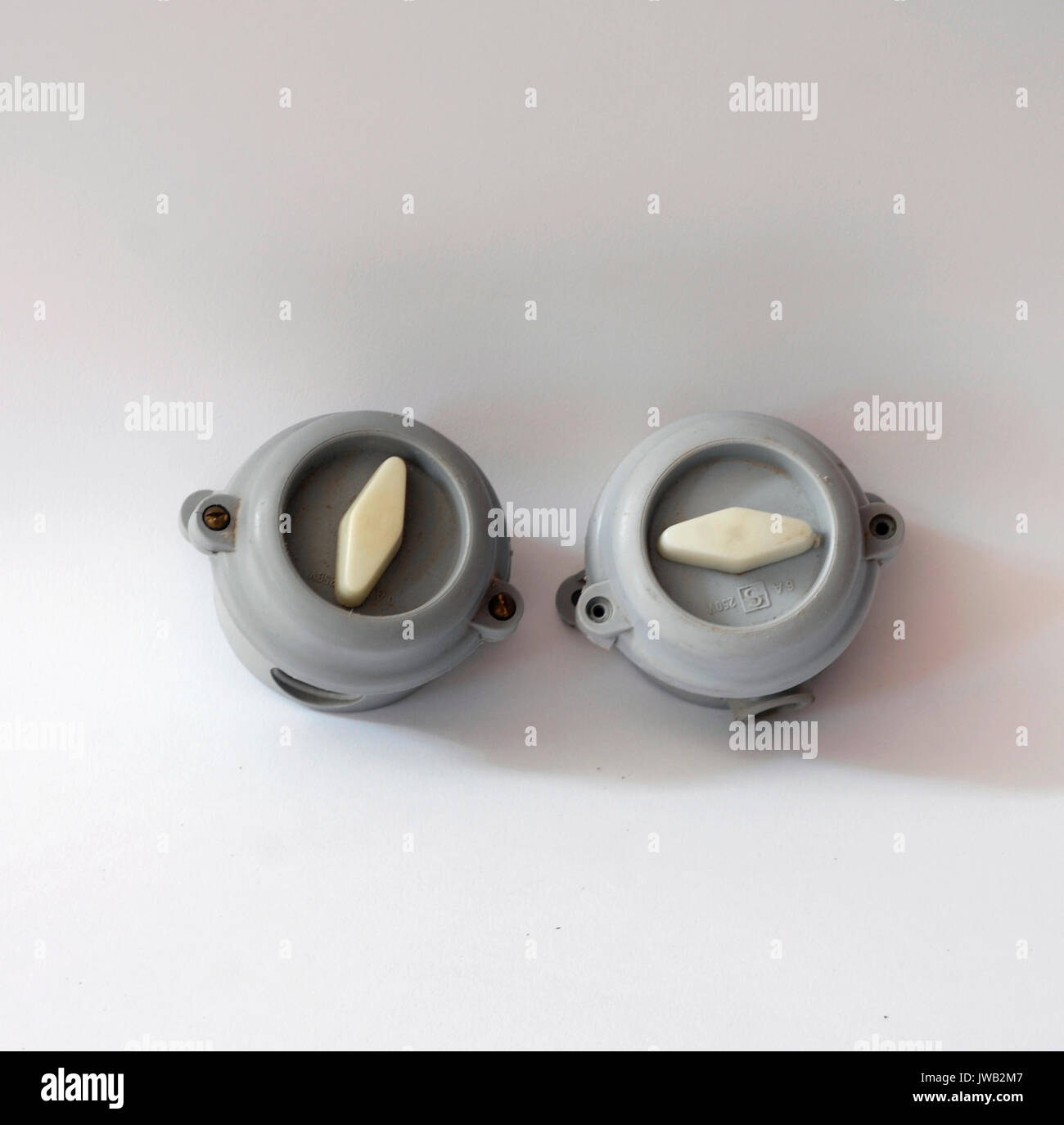 Pair of vintage plastic outdoor rotary switches Stock Photo - Alamy