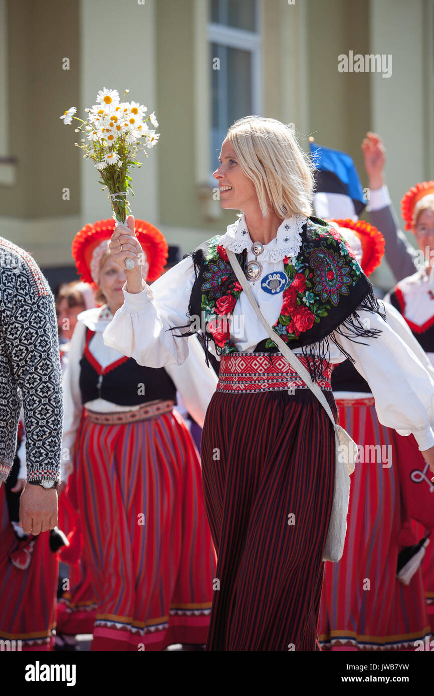 TALLINN, ESTONIA - 04 JUL 2014: People in Estonian costumes going at ...