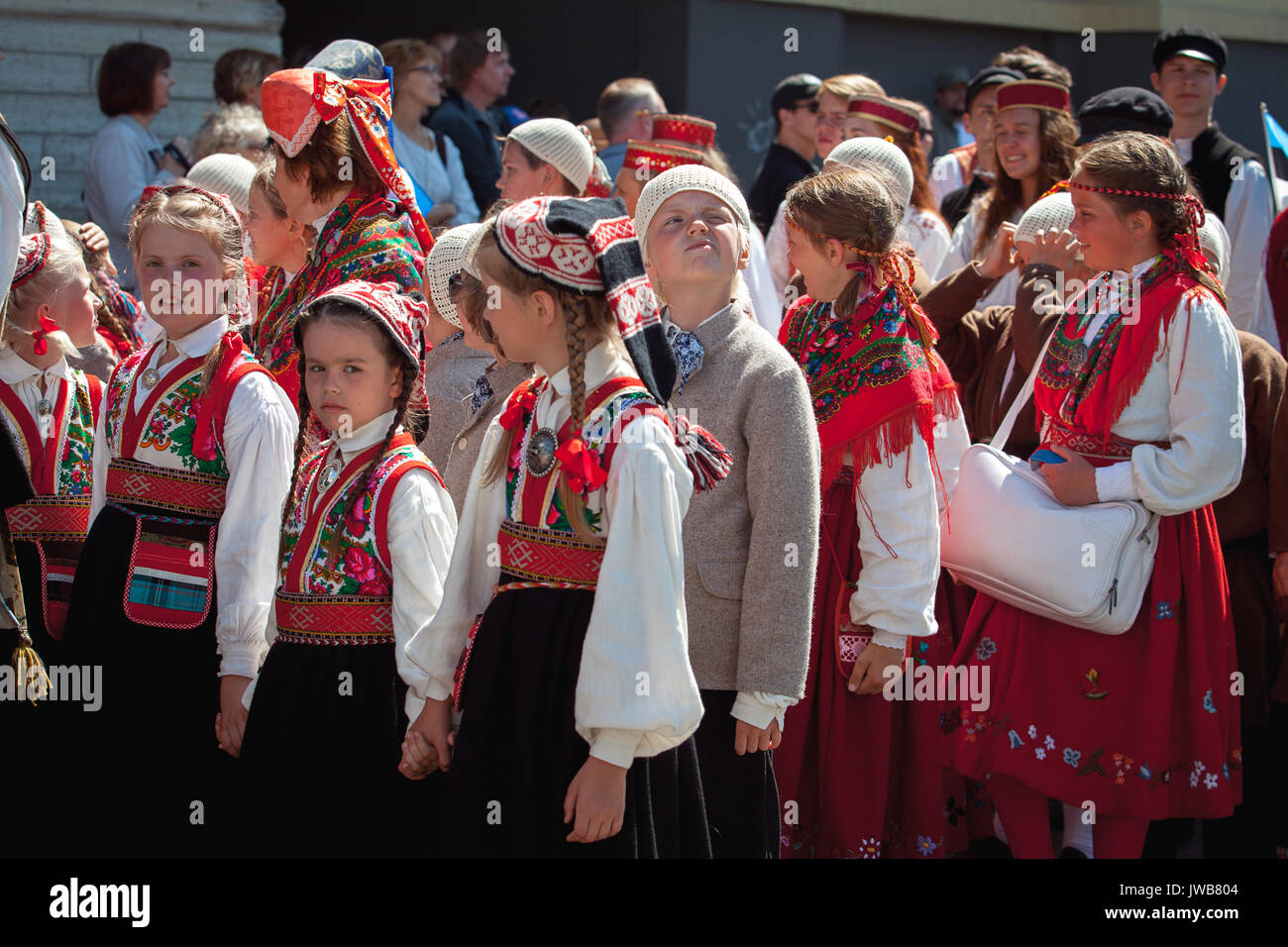 TALLINN, ESTONIA - 04 JUL 2014: People in Estonian costumes going at ...